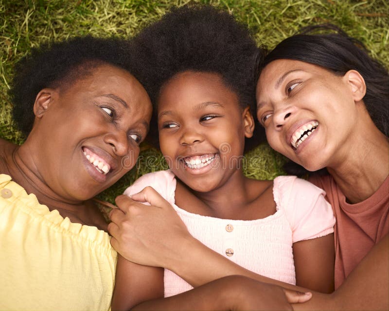 Looking Down on Three Generation Female Family Laughing and Lying on ...