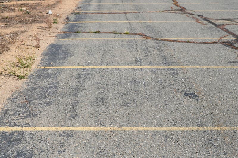 Looking Down at Yellow Lines in Empty Parking Lot Stock Photo - Image ...