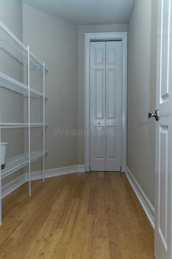 An Empty Storage Unit with Shelving Stock Photo - Image of city ...