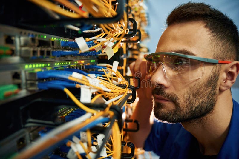 Looking Extremely Close at Cables. Young Man is Working with Internet ...