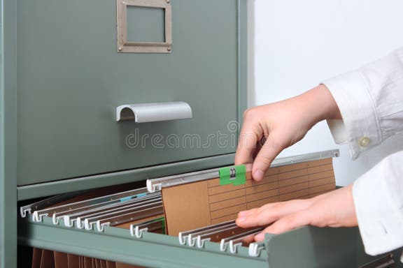 Looking through the files stock photo. Image of searching - 13285268