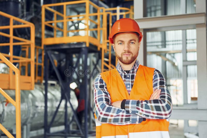 Looking Forward. Construction Worker in Uniform is in the Factory Stock ...