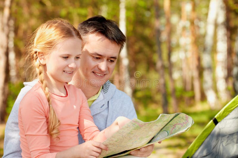 Looking at guide stock image. Image of daughter, camping - 22114271