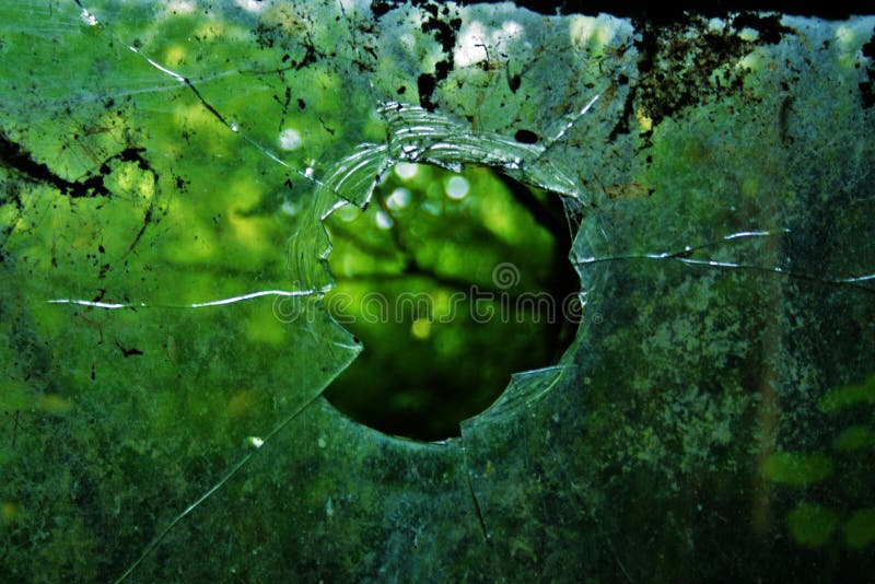 Broken Window with Cracks through Glass Looking into Trees Stock Image ...