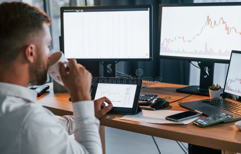 Looking at Information. Young Businessman in Formal Clothes is in ...