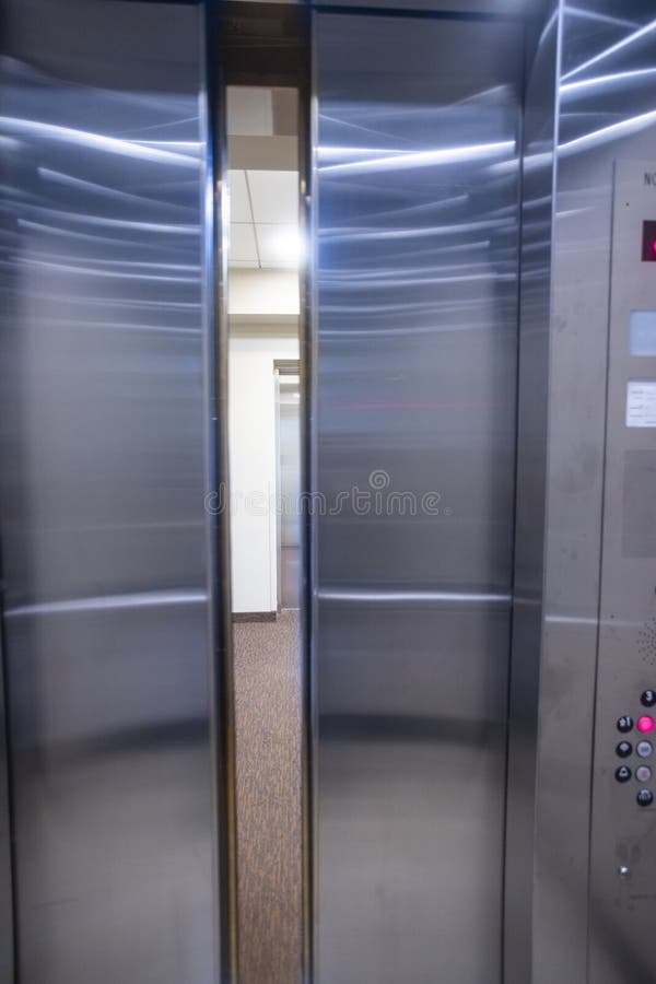 Looking from Inside a Silver Elevator To the Outside with the Doors Partially Opened Stock Photo ...
