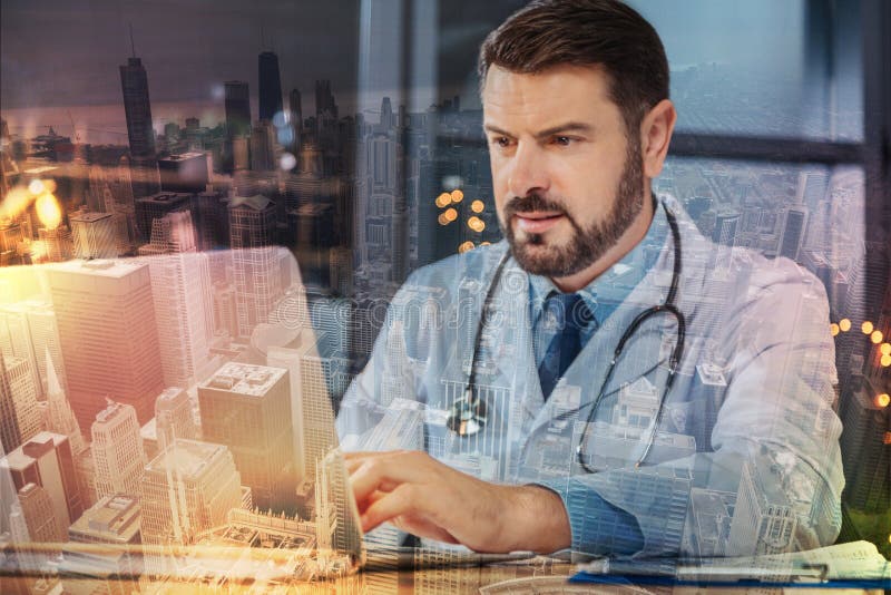 Clever Doctor Feeling Interested while Looking at the Screen Editorial ...