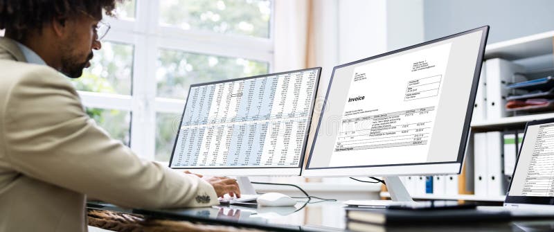 Looking at Invoice and Spreadsheet on Computer Stock Photo - Image of ...