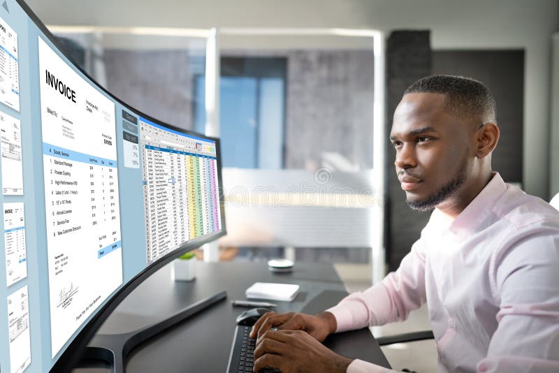 Looking at Invoice and Spreadsheet on Computer Stock Photo - Image of ...