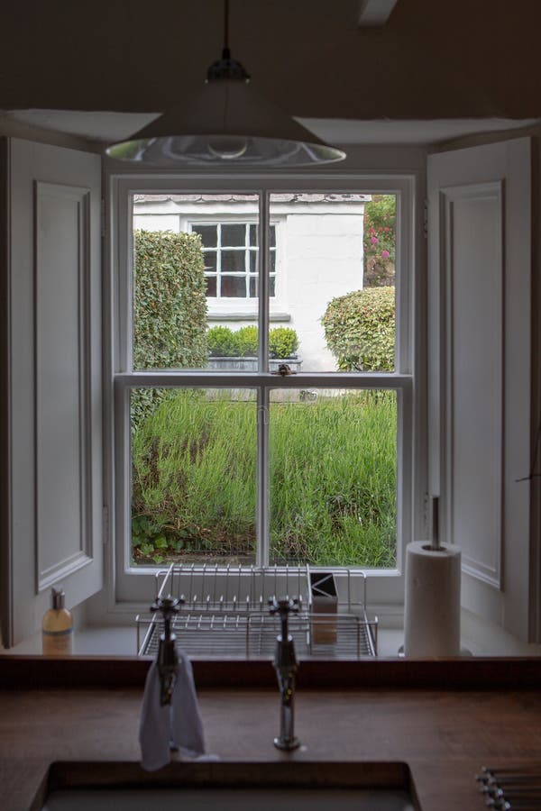 Kitchen Window into Backyard of Lavender & Shrubs Stock Photo - Image ...