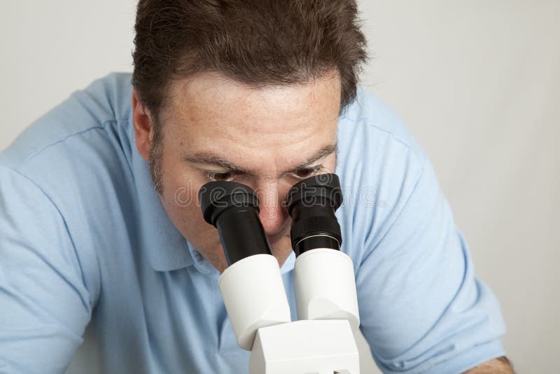 Looking through Microscope stock photo. Image of biotechnology - 11373524