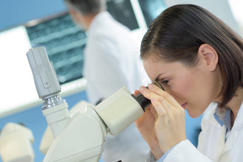 She Looking through Microscope Stock Photo - Image of conduct, findings ...