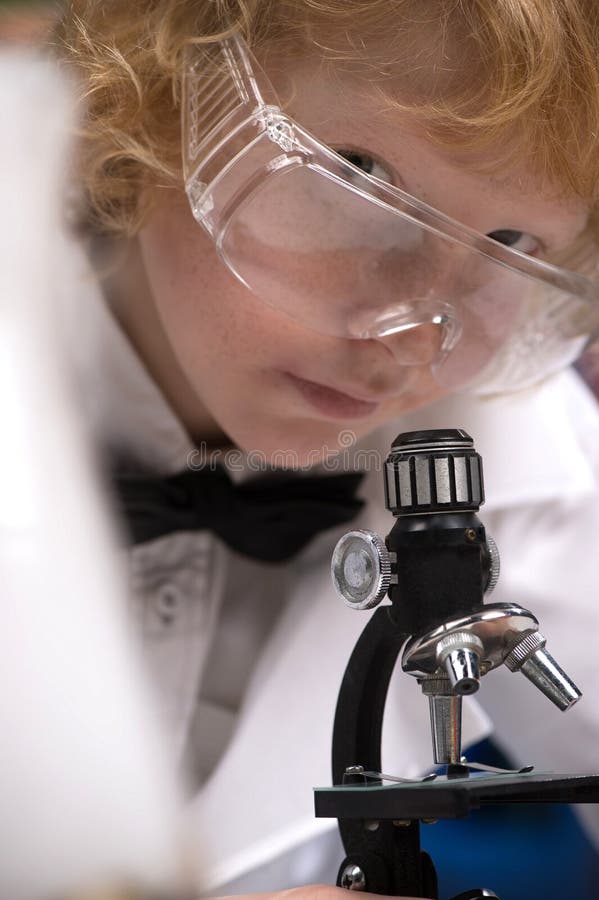 Boy In Glasses Is Looking Into Microscope Stock Image - Image of ...