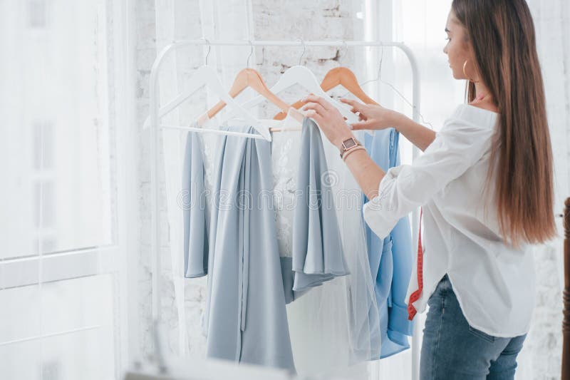 Looking for the Needed Cloth. the Process of Fitting the Dress in the ...