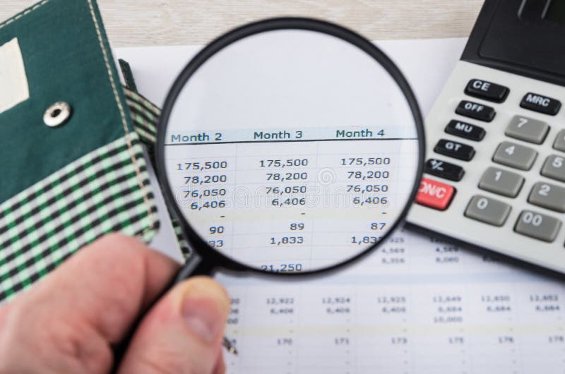 Looking Numbers on Printout with Magnifying Glass Stock Photo - Image ...