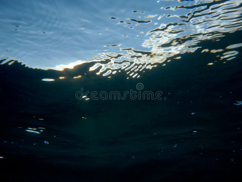 Looking through Ocean Water at Blue Sky with Water Ripples Stock Photo ...