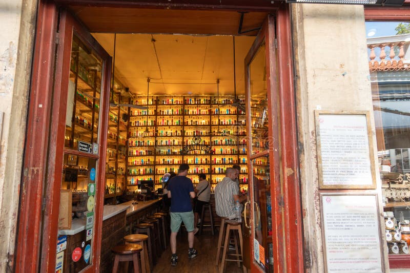 Looking through Open Doors into Dimly Lit Bar with Shelves of ...
