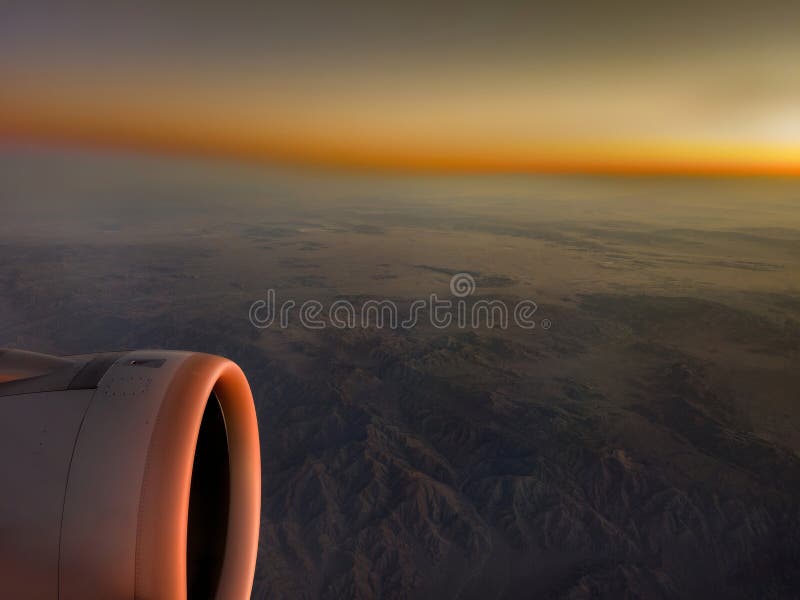 Looking Out the Window of an Airplane with Partial Wing and Engine View ...