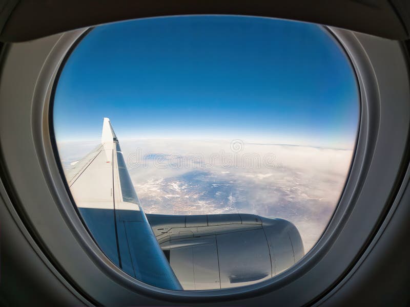 Looking Out the Window of a Jet Airplane Over the Wing Stock Image ...