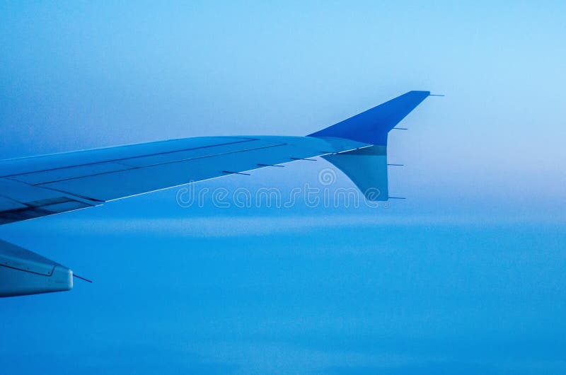 Looking Out Airplane Window and Flying Above the Clouds Stock Image ...