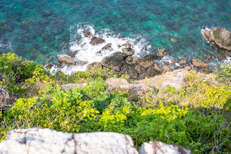 Looking Over a Cliff Edge with Blue Sea Below and Cliff Edge and the ...