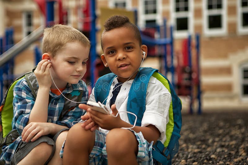 Looking at the Phone stock photo. Image of friends, backpack - 33710444