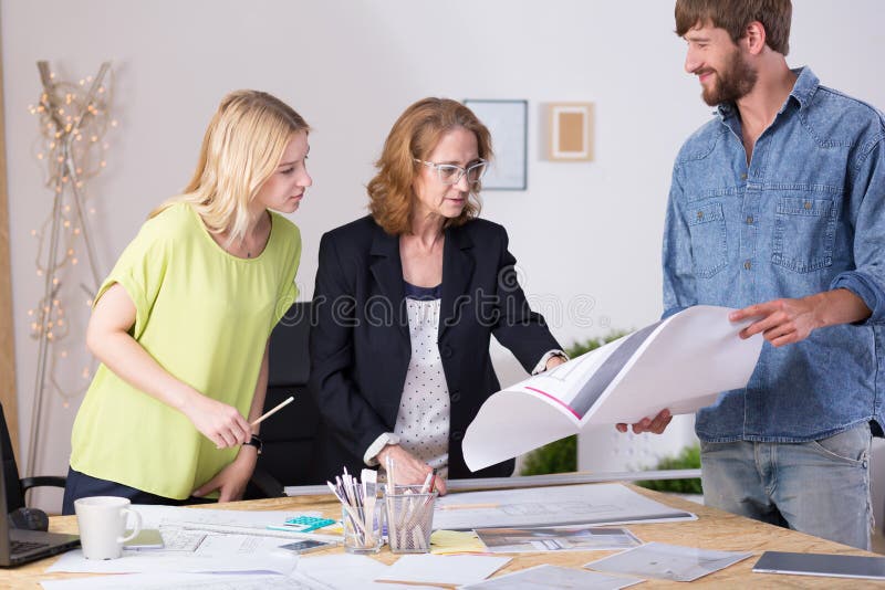 Looking at plans stock photo. Image of architect, studio - 77668354