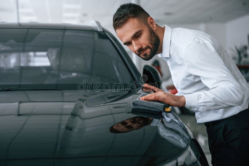 Looking at Polished Surface. Worker in Formal Clothes is in the Auto ...