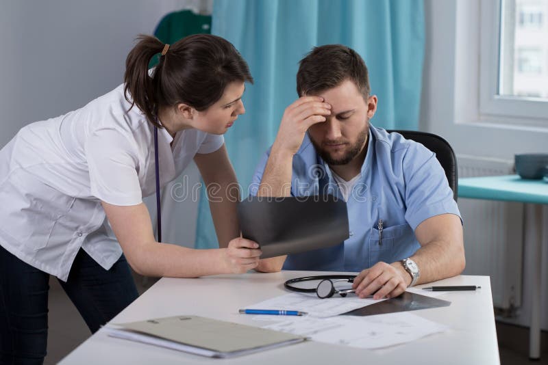 Looking on X-rays stock image. Image of doctors, look - 57884623