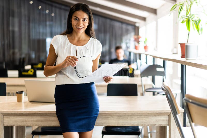 Looking for the Right Document. Beautiful Young Woman Examining ...