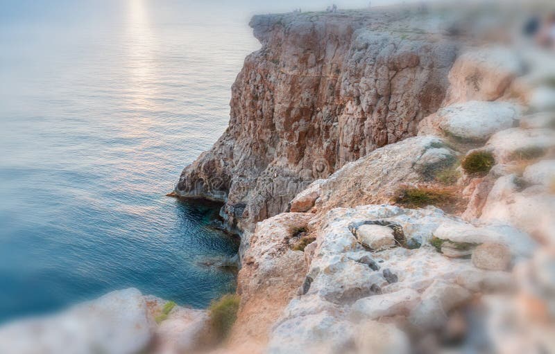 Looking at Sunset Over a Cliff Stock Photo - Image of dusk, scenery ...