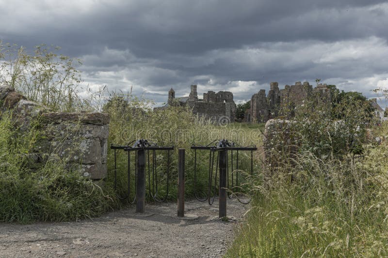 Looking through Unique Retro Turnstiles at the Ruins of an Old Ancient ...