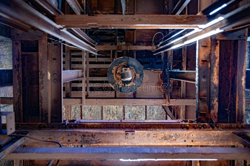 Looking Up an Abandoned Elevator Shaft – Rusty Industrial Mechanism in ...