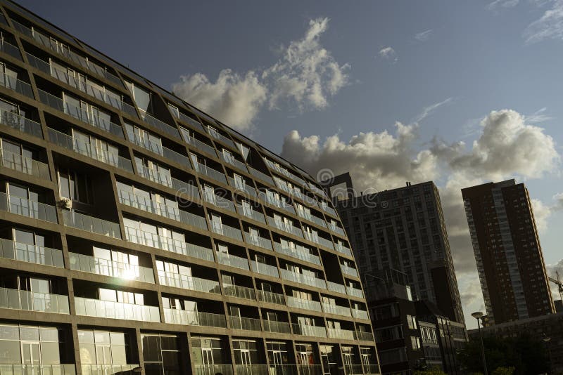Looking Up at Blue Sky through Modern Buildings Low Angle View. Sun ...