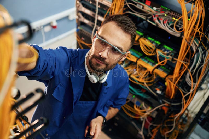 Looking Up, Management of Cables. Young Man is Working with Internet ...