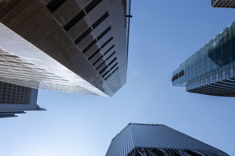 Looking Up Modern High-rise Office Buildings with Blue Sky Stock Photo ...