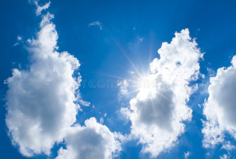 Looking Up at Nice Blue Sky with Sun Beam Behind Big Cloud Stock Photo ...
