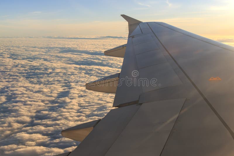 Looking through the Window Aircraft at Sunset during the Flight Stock ...