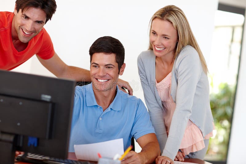 That Looks Great. a Group of Designers Working Together in Front of a ...