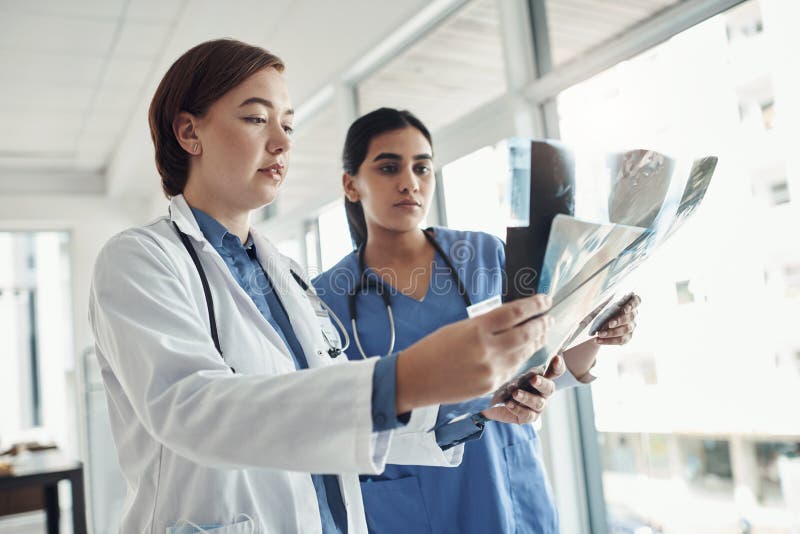 Looks Like the Patient is in Good Hands. Two Young Doctors Checking ...