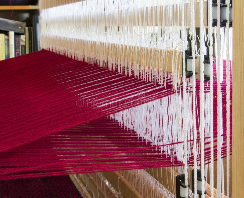 A Loom Set Up with Red Wool Warp Threads Ready for Weaving Stock Photo ...