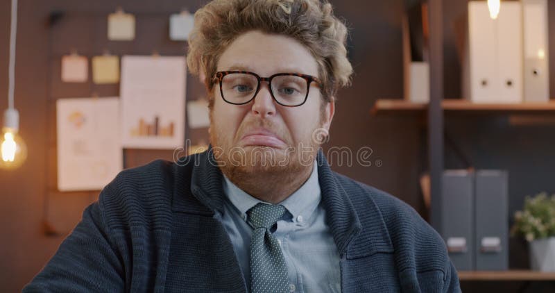 Loop of Businessman Making Sad Face Expression and Looking at Camera ...