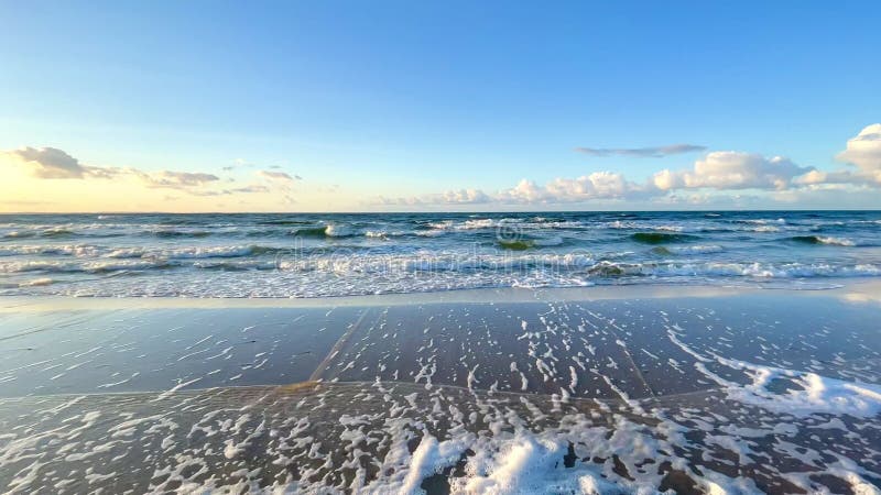 Loop Features Foamy Gentle Waves Breaking on a Sandy Beach Under a ...