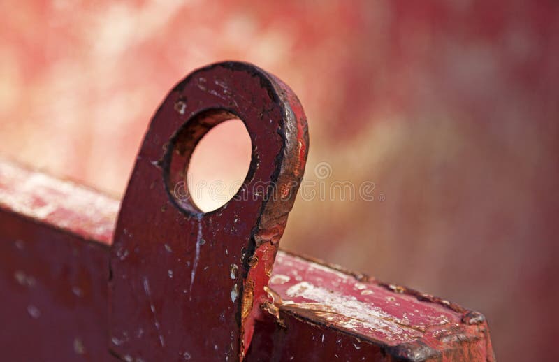 A Loop of Red Colored Metal with a Blurred Background Stock Image ...
