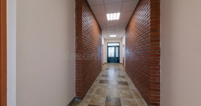 Loop Seamless Rotation in White Empty Long Corridor with Red Brick ...