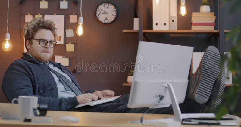 Loop of Stressed Employee Typing and Looking at Computer Screen Working ...