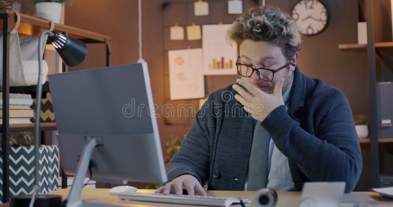 Loop of Tired Office Worker Yawning Feeling Sleepy while Working with ...
