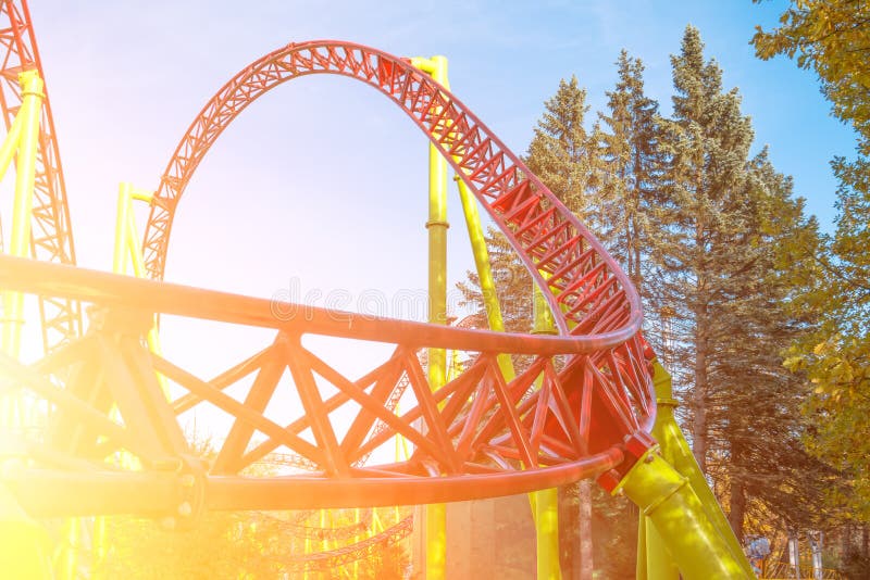 Loop and Turn on a Red Roller Coaster in an Amusement Park Stock Photo ...