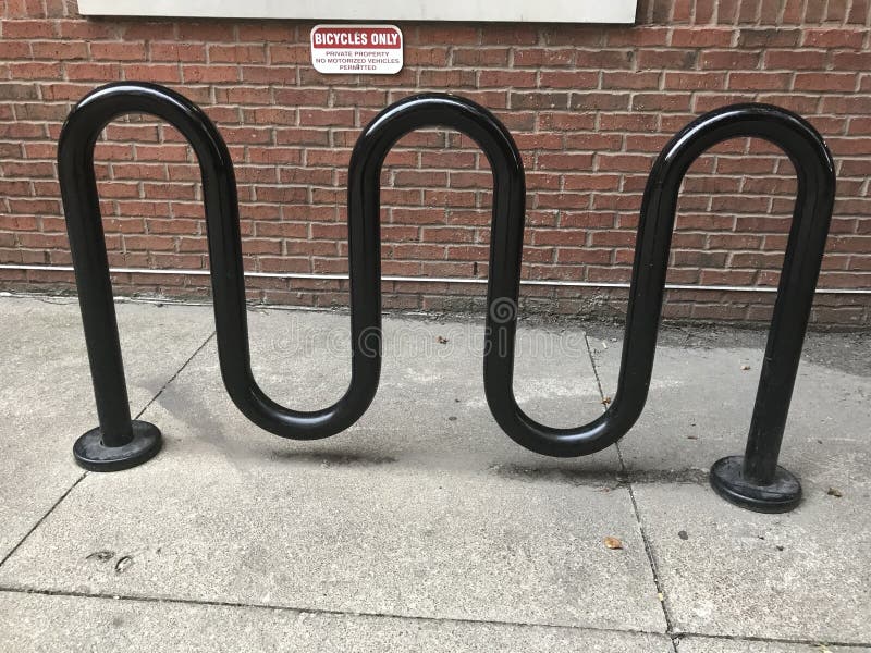 7 Loop Wave Bike Rack in Sidewalk. Photo Image Stock Photo - Image of ...