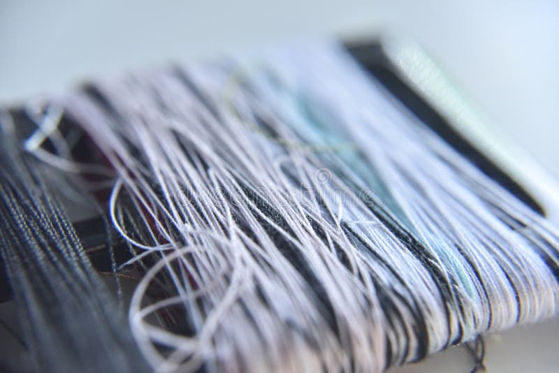 Loose Threads Spooled Around a Black Frame Stock Photo - Image of blury ...